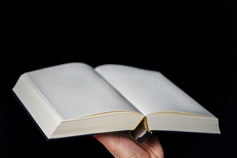 Open book held by a hand stock image. Image of library - 139294843