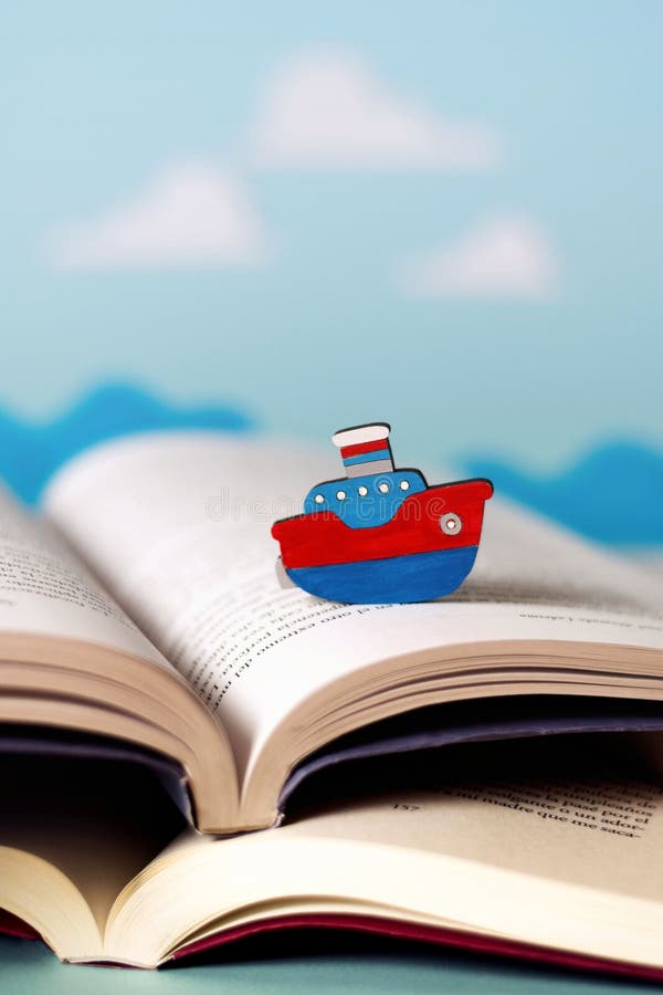 An Open Book with a Boat Shaped Magnet Stuck on Top Stock Image - Image ... An Open Book with a Boat Shaped Magnet Stuck on Top Stock Image - Image ...