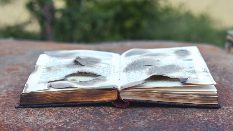 An Open Book with Burnt Pages after a Fire Stock Photo - Image of paper ...