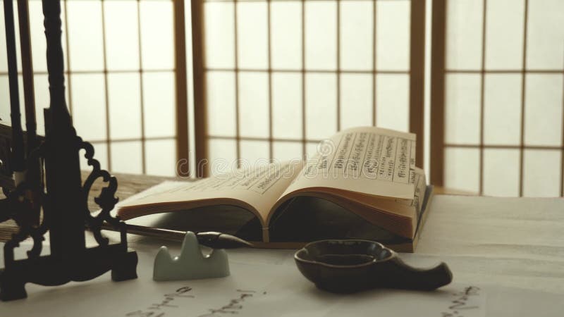 Open Book with Calligraphy Tools on a Desk Stock Footage - Video of ...