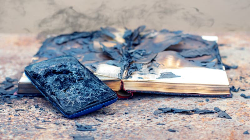 A Charred Open Book on a Wooden Table. a Book Saved from a Fire Stock ...
