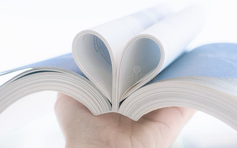 Open Book with Curled Leaves in the Shape of a Heart Stock Image ...