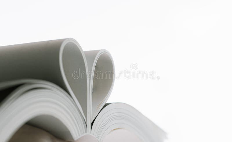 Open Book with Curled Leaves in the Shape of a Heart Stock Photo ...