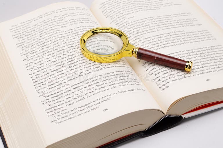 Open Book with Dense Text and a Magnifying Glass for Close Reading ...
