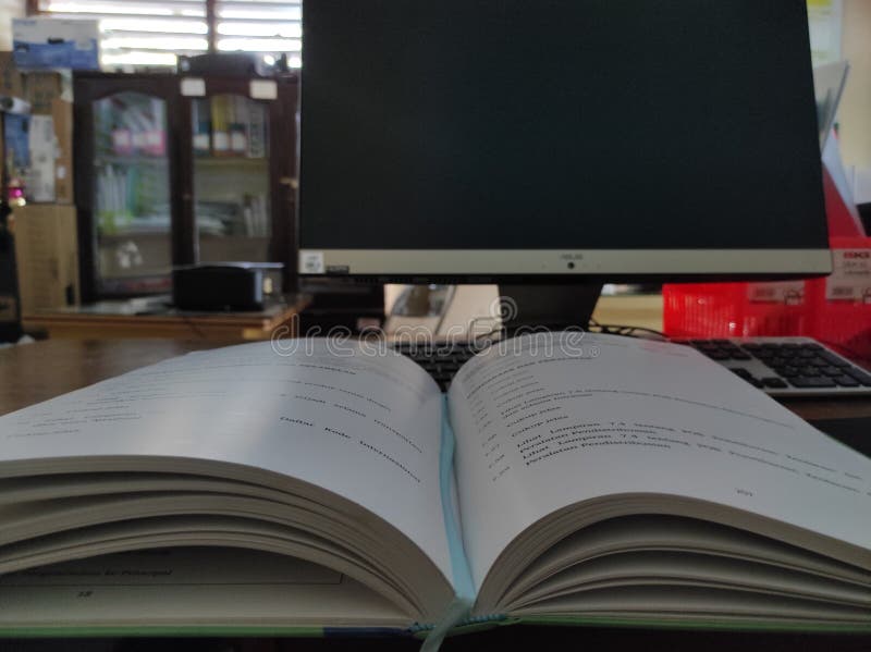 Open Book on Desk in Front of Computer in Office Room Stock Image ...