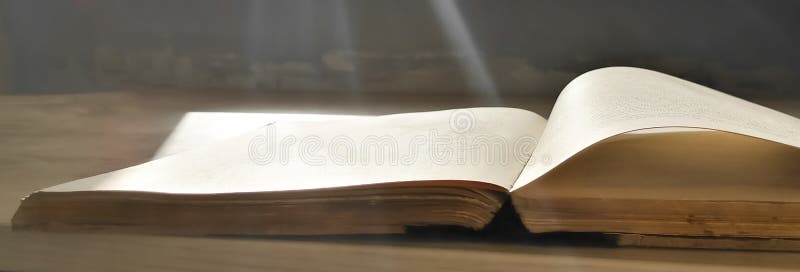 On the Open Book Fall Rays of Sunlight from the Window. Light. Sunlight ...