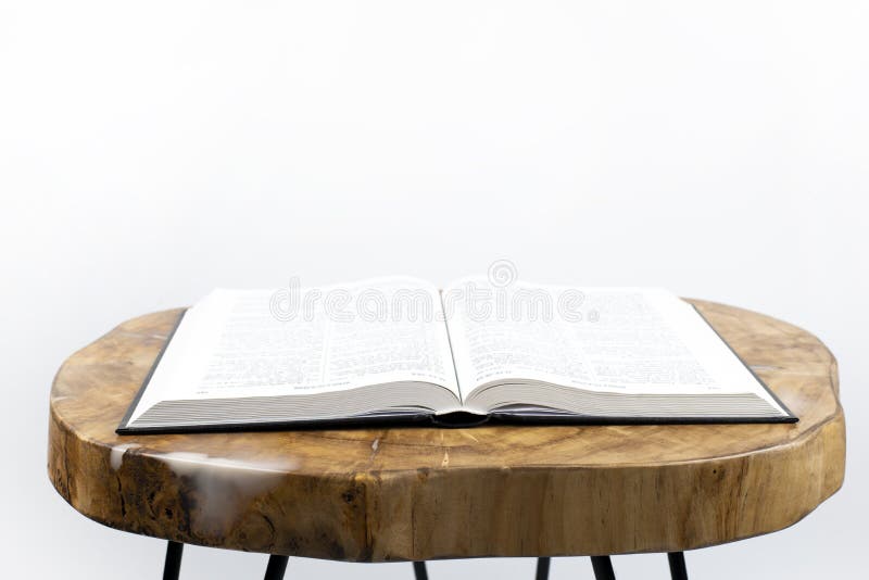 Open Book. Holy Bible. on a Wooden Table. on a White Background. Stock ...