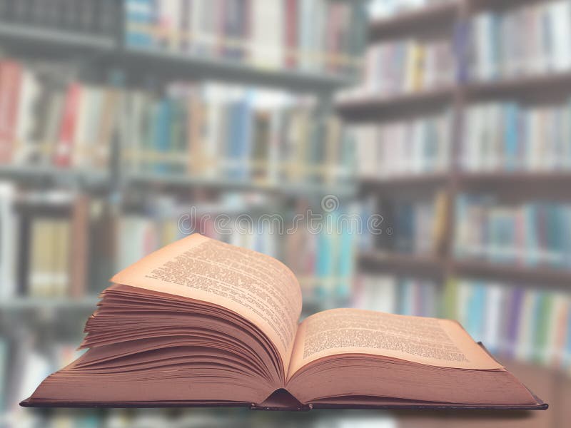 Open Book in Library and Blurred Bookshelf Stock Photo - Image of ...