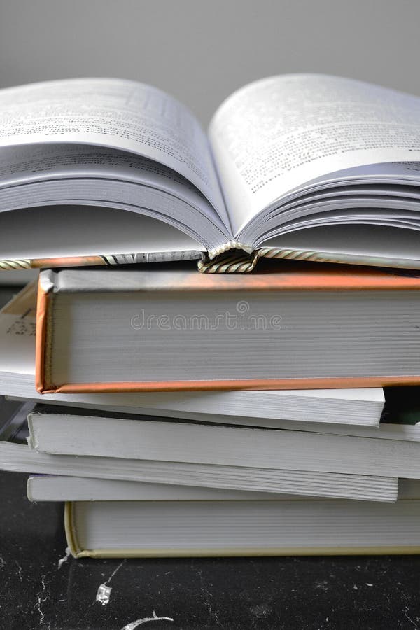 An Open Book Lies on a Stack of Books Stock Image - Image of textbook ...