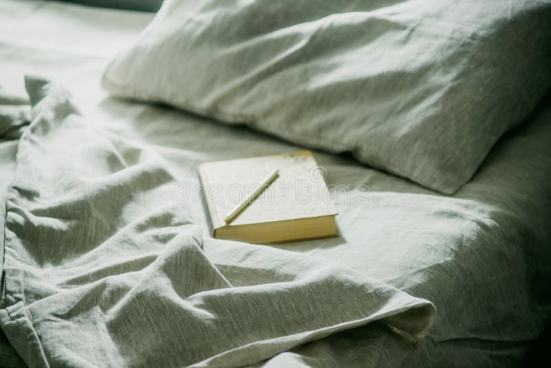 Open Book on Linen Bedding on the Bed Stock Photo - Image of education ...