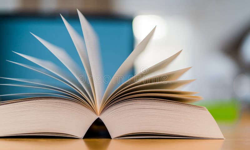 Open Book Lying on the Table in the Library Stock Photo - Image of ...