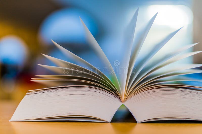 Open Book Lying on the Table in the Library Stock Image - Image of ...
