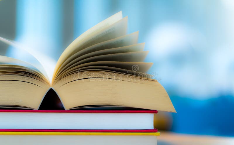 Open Book Lying on the Table in the Library Stock Photo - Image of ...