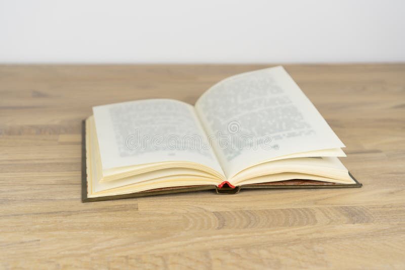 Open Book Lying on Wooden Table Stock Photo - Image of brown, wooden ...