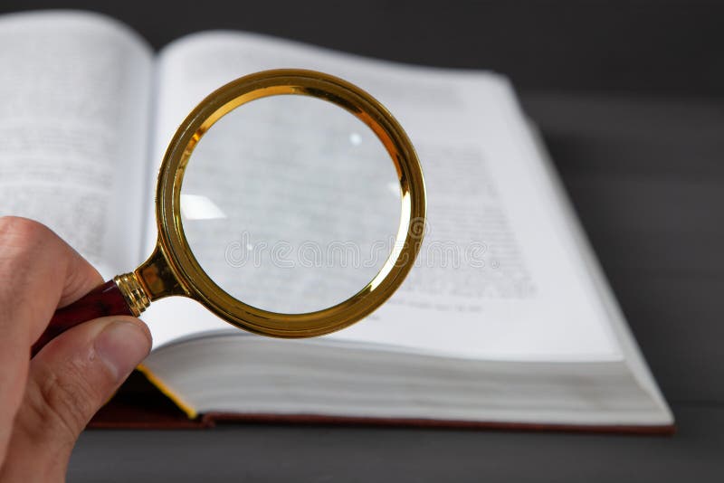 Open Book and Magnifying Glass. Search for Books Stock Image - Image of ...