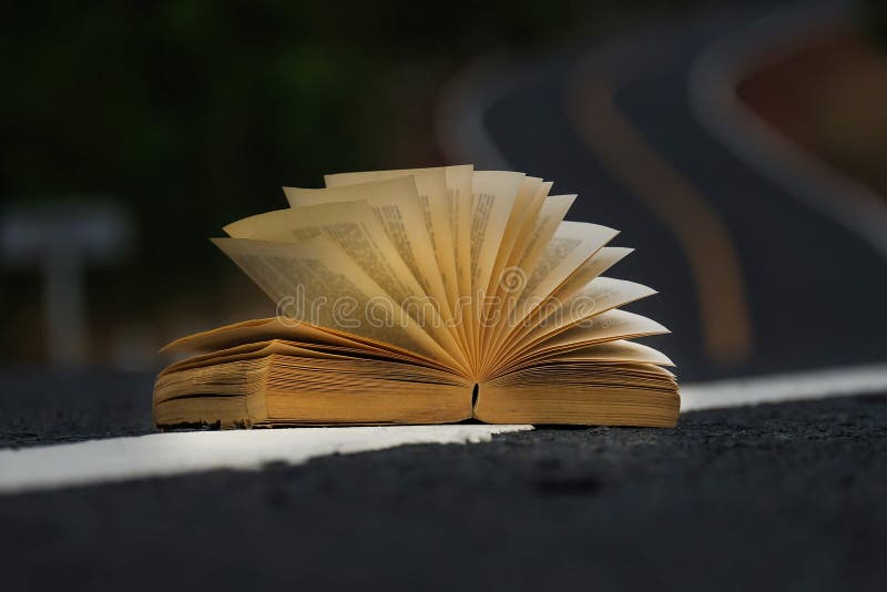 Open Book on the Middle of the Road and Soft Focus on Subject. Concept ...
