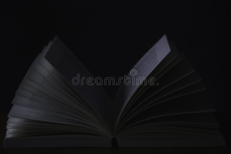 Open Book Pages in a Dark Room on a Table. Book Pages Stock Image ...