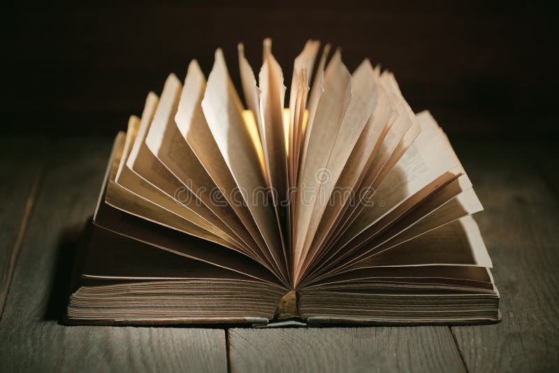 An Open Book with Open Pages, a Thick Old Book on the Table, Knowledge ...