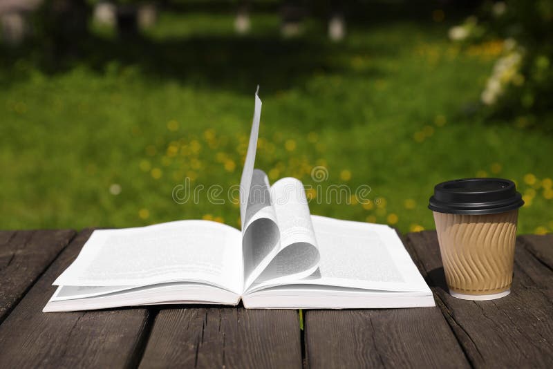 Open Book and Paper Coffee Cup on Wooden Table Outdoors Stock Image ...