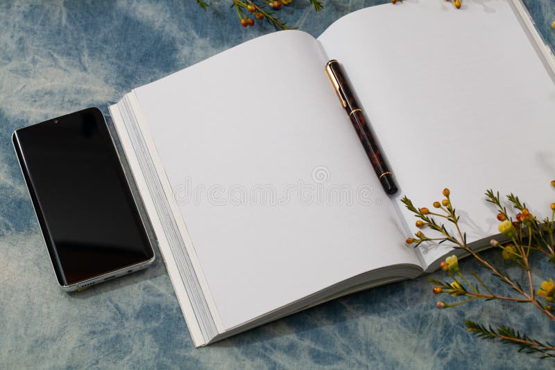 Open Book, Phone and Pen on the Blue Cloth Stock Image - Image of ...
