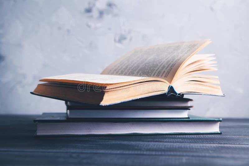 Open Book on a Pile of Books Stock Photo - Image of training, education ...