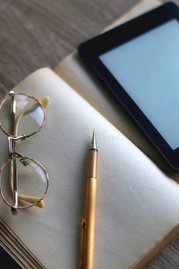 Open Book, Reading Glasses, Mechanical Pencil and E-Reader Stock Photo ...