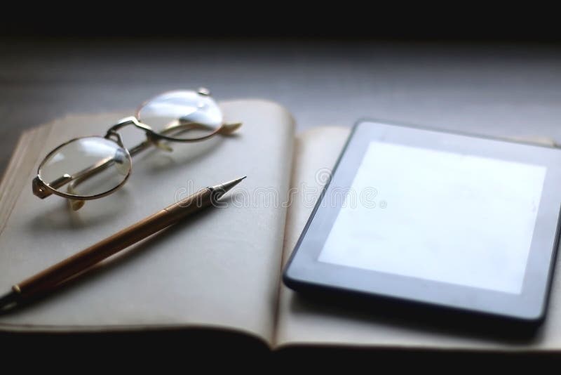 Open Book, Reading Glasses, Mechanical Pencil and E-Reader Stock Photo ...