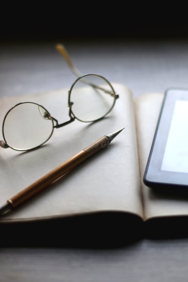 Open Book, Reading Glasses, Mechanical Pencil and E-Reader Stock Image ...