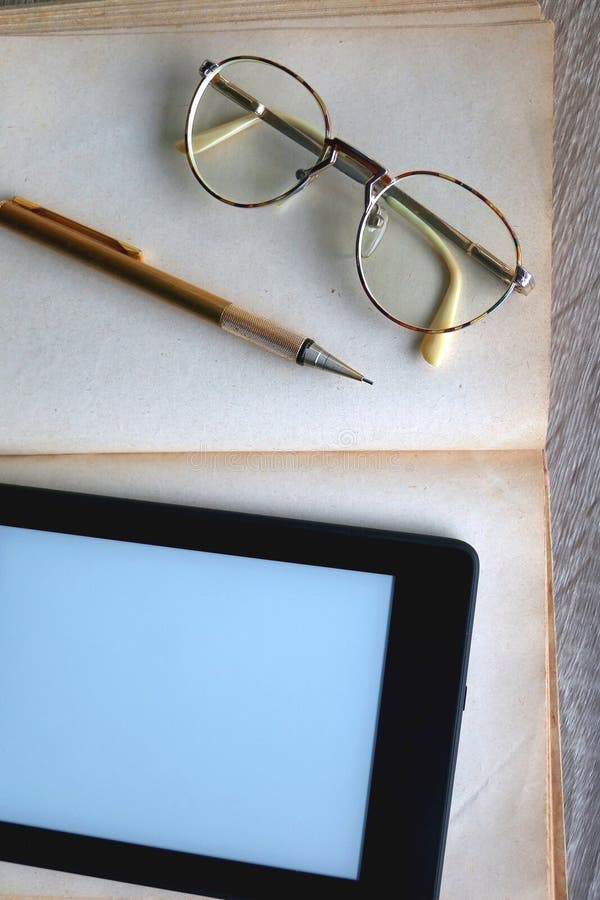 Open Book, Reading Glasses, Mechanical Pencil and E-Reader Stock Photo ...