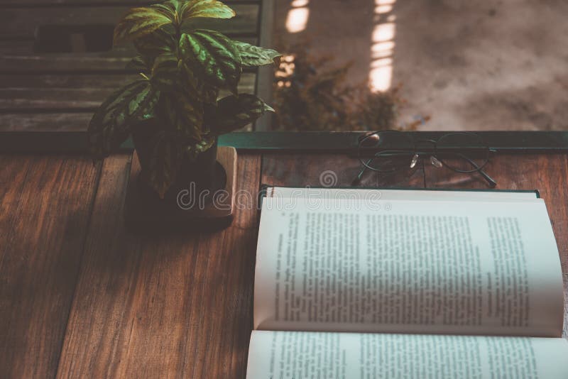 Open Book with Reading Glasses on Table. Stock Image - Image of glasses ...