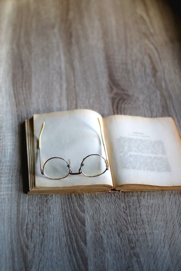 Open Book and Reading Glasses Stock Image - Image of book, field: 245751755