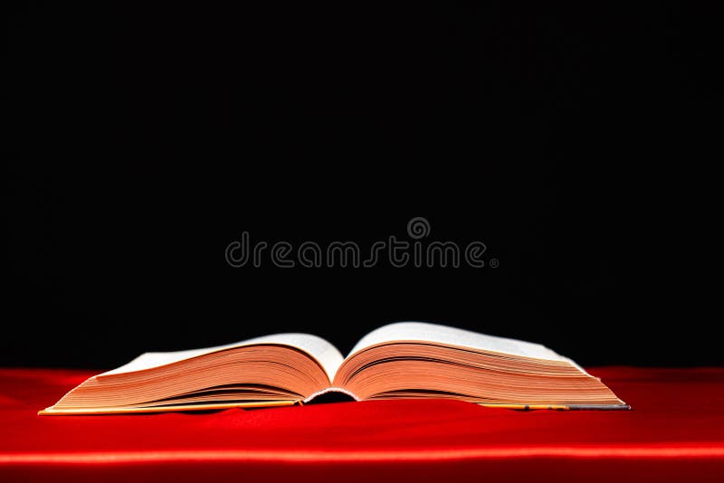 Open Book on Red and Black Background. the Wisdom of Generations ...