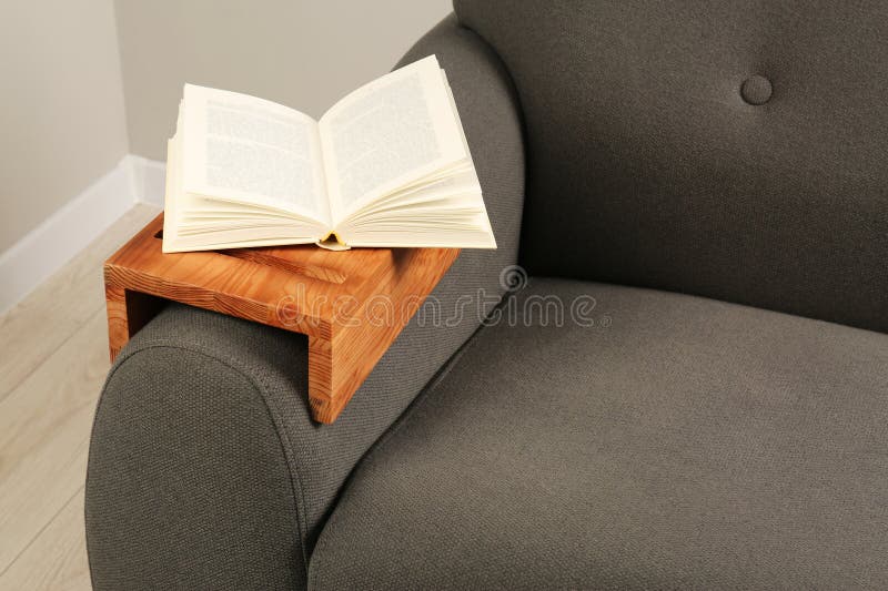 Open Book on Sofa with Wooden Armrest Table in Room. Interior Element ...
