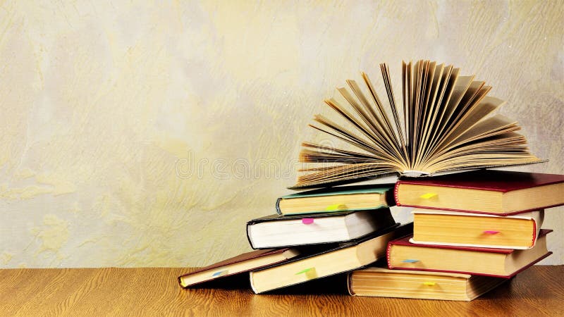 An Open Book on a Stack of Books with Bookmarks. Stock Photo - Image of ...