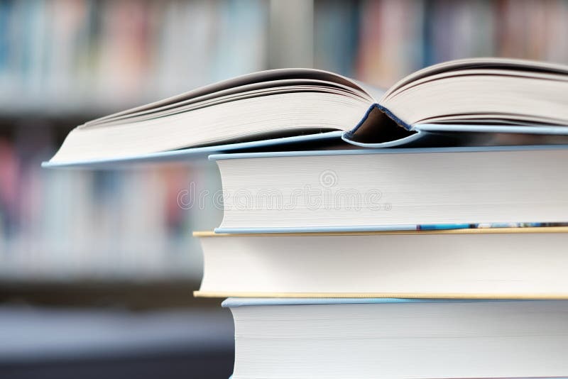 Open Book on a Stack of Books in a Library Stock Photo - Image of ...