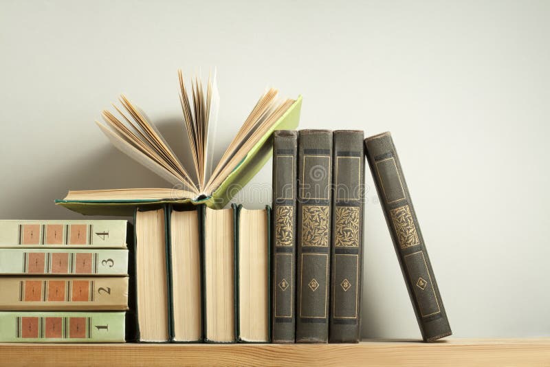 Open Book on Stack of Books on Wooden Table. Education Background. Back ...