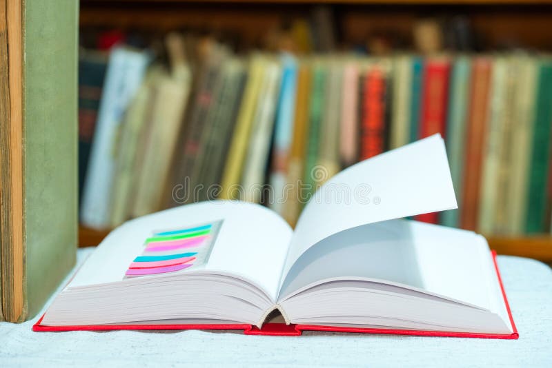 Open Book, Stack of Hardback Books on Table. Top View. Stock Image ...