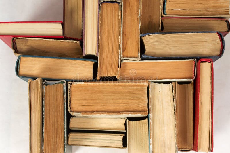 Open Book, Stack of Hardback Books on Table. Top View. Stock Photo ...