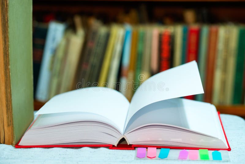 Open Book, Stack of Hardback Books on Table. Top View. Stock Image ...