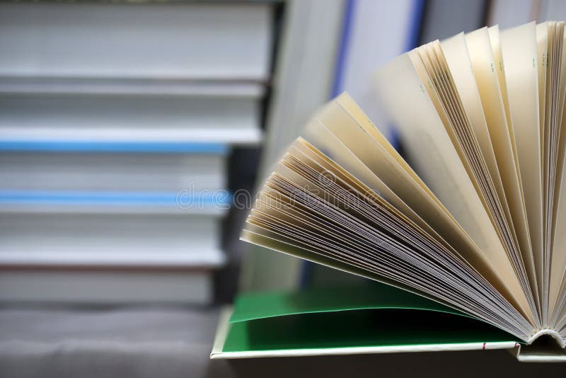 Open Book, Stack of Hardback Books on Table. Top View. Stock Photo ...