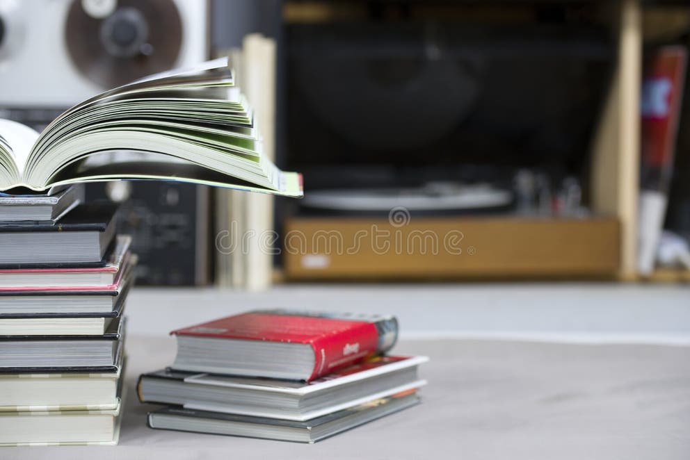 Open Book, Stack of Hardback Books on Table. Top View. Stock Photo ...