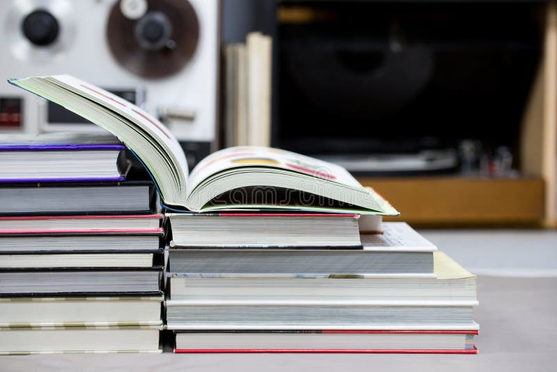 Open Book, Stack of Hardback Books on Table. Top View. Stock Image ...