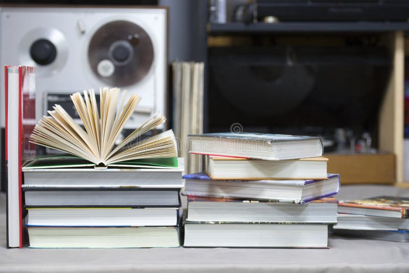 Open Book, Stack of Hardback Books on Table. Top View. Stock Image ...