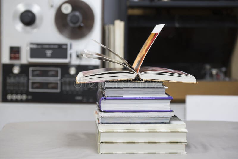 Open Book, Stack of Hardback Books on Table. Top View. Stock Image ...