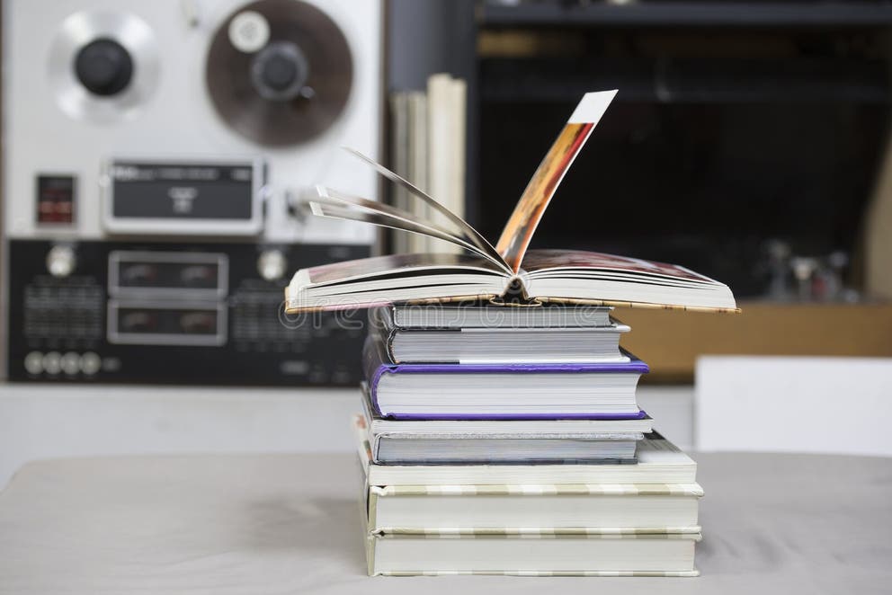 Open Book, Stack of Hardback Books on Table. Top View. Stock Image ...