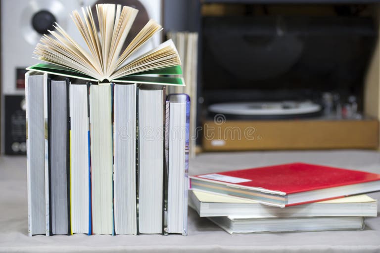 Open Book, Stack of Hardback Books on Table. Top View. Stock Image ...
