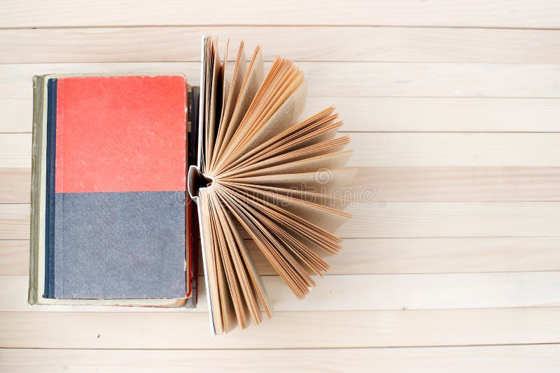 Open Book, Stack of Hardback Books on Table. Top View. Stock Image ...