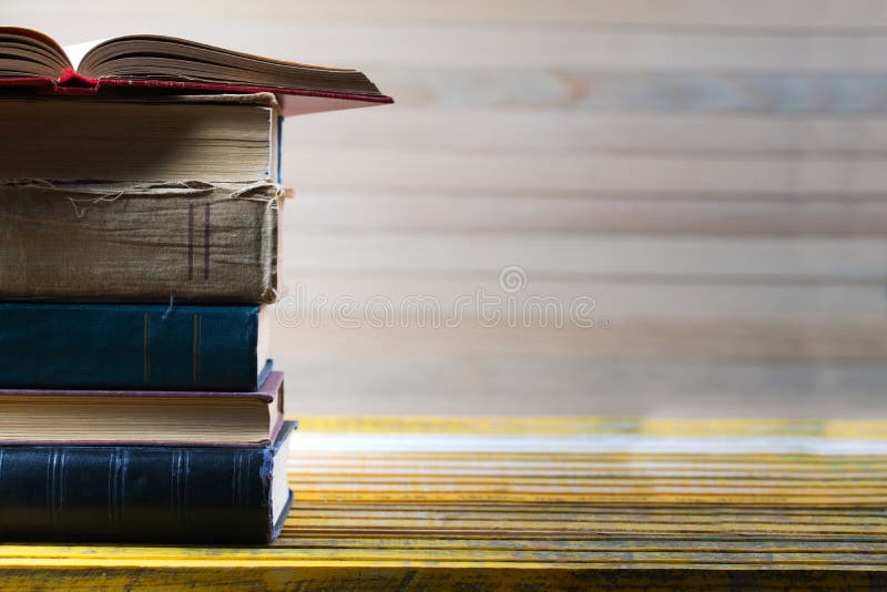 Open Book, Stack of Hardback Books on Wooden Table. Stock Photo - Image ...