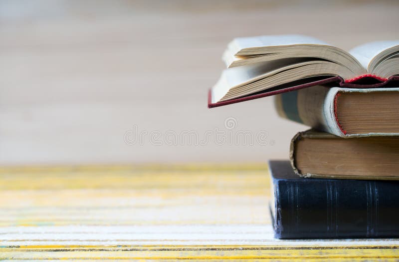 Open Book, Stack of Hardback Books on Table. Top View. Stock Image ...