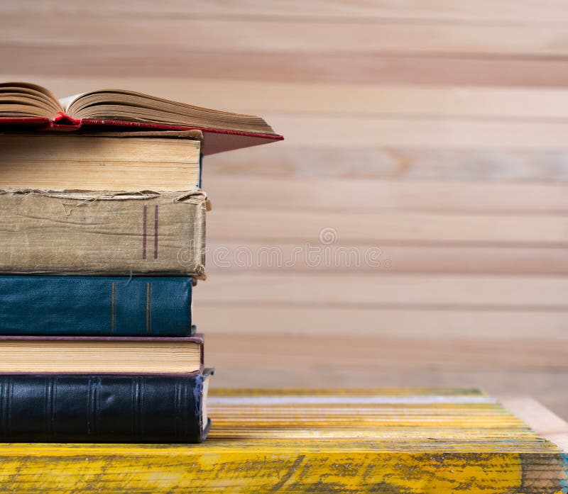 Open Book, Stack of Hardback Books on Wooden Table. Stock Image - Image ...